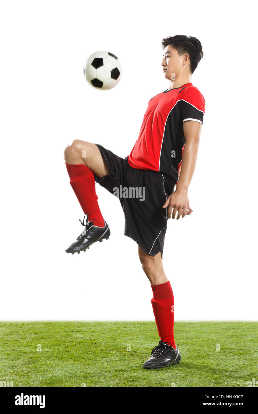 Football player is playing football Stock Photo - Alamy