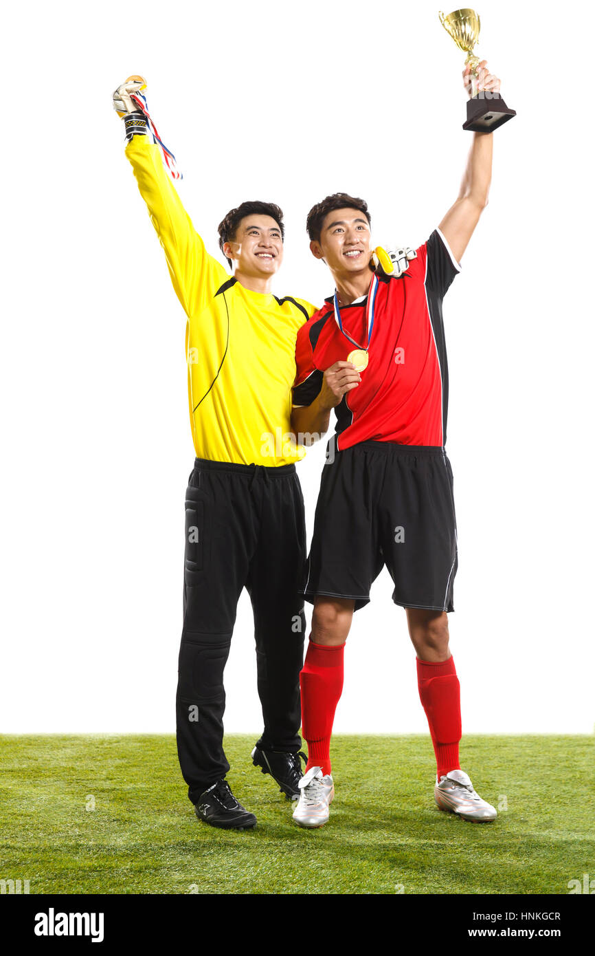 Football players celebrate success Stock Photo - Alamy