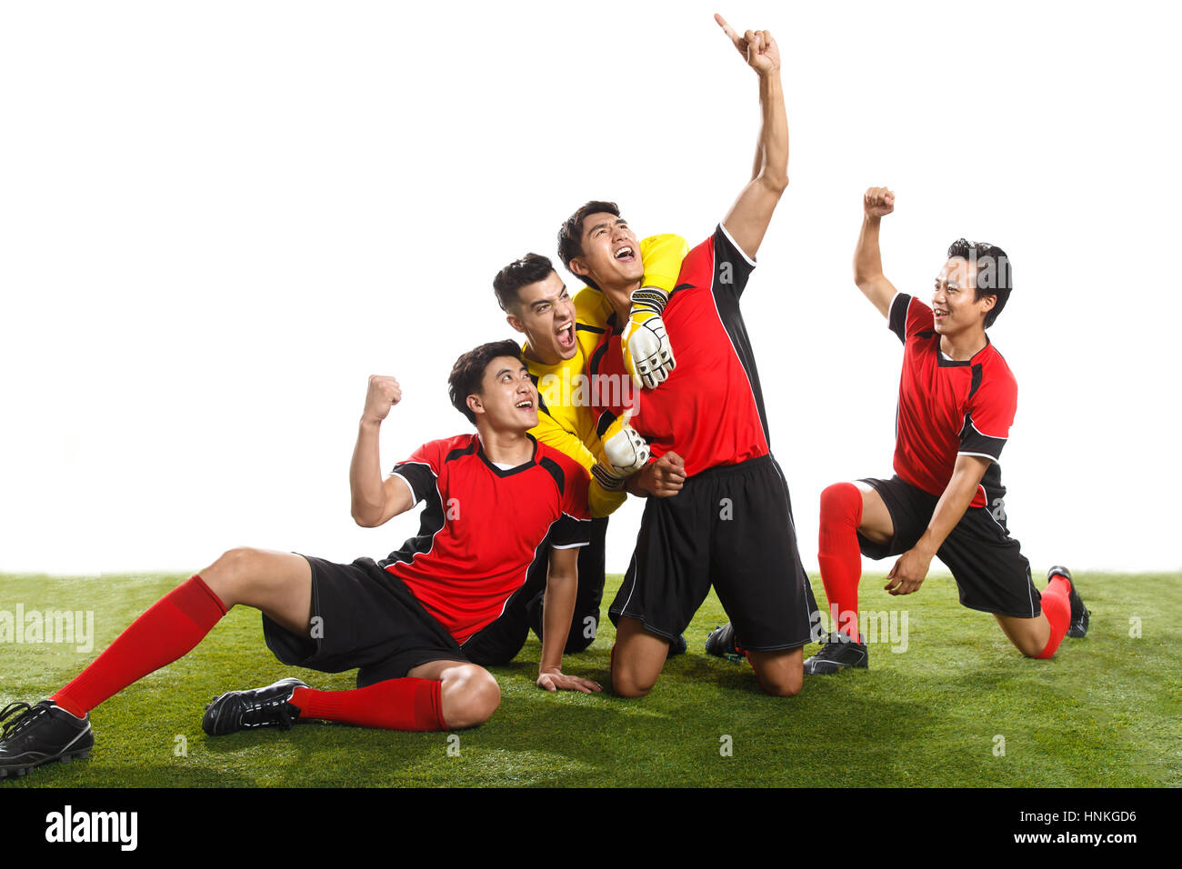 Football players celebrate success Stock Photo - Alamy
