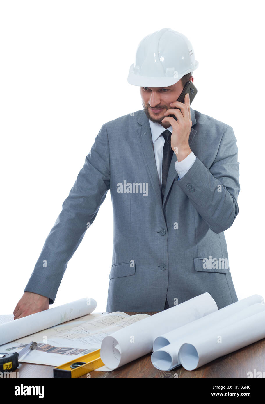 Architect talking on call phone at work place Stock Photo - Alamy