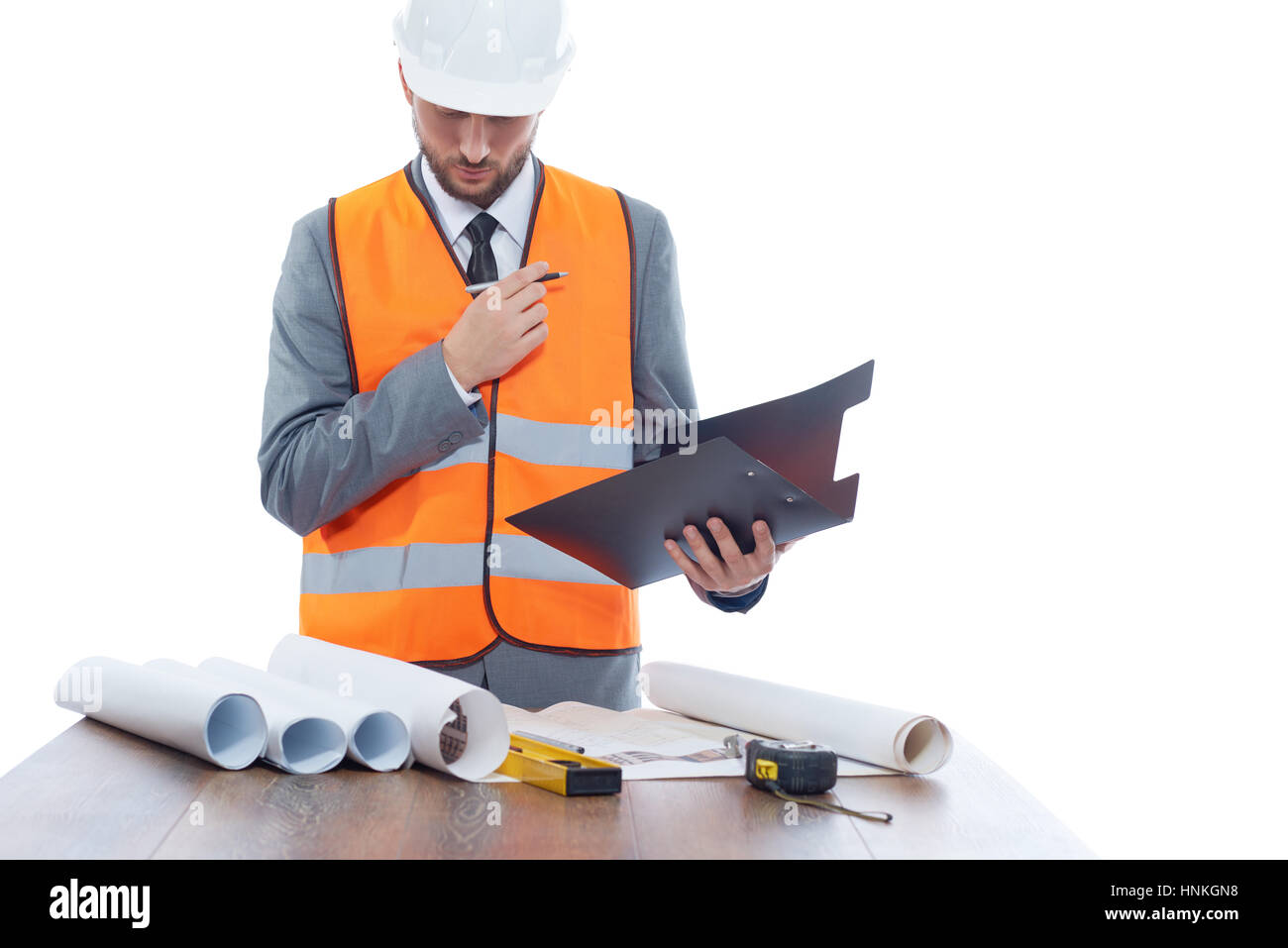 Engineer reading drawing plan of building and analyzing Stock Photo - Alamy