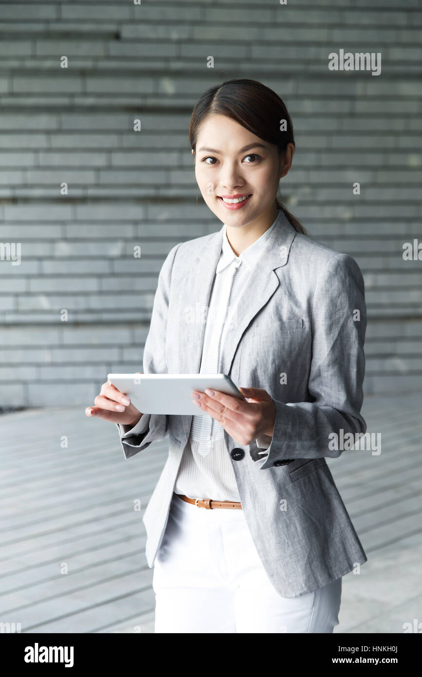 Business women use tablet computers Stock Photo - Alamy