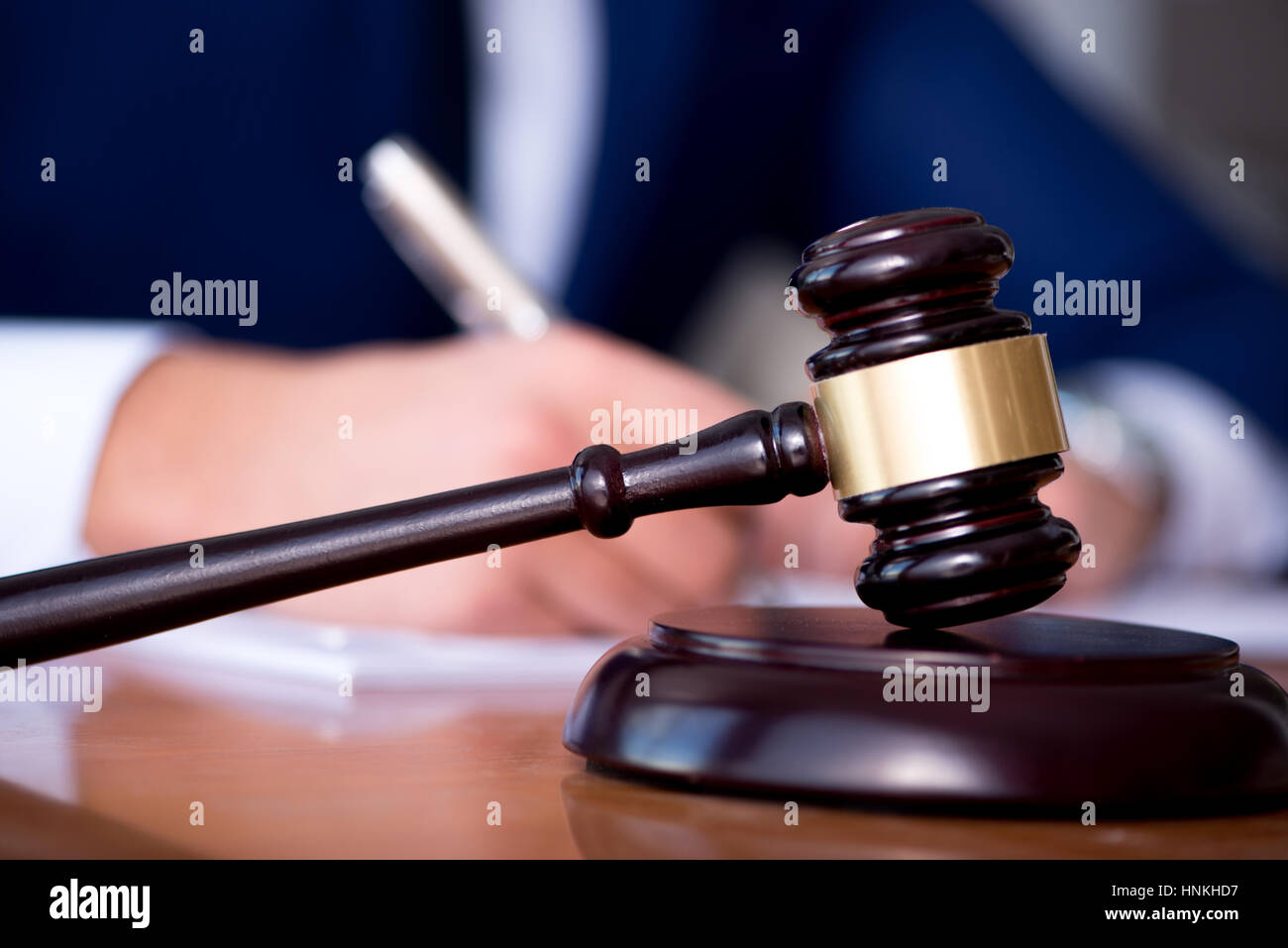 Handsome judge with gavel sitting in courtroom Stock Photo - Alamy