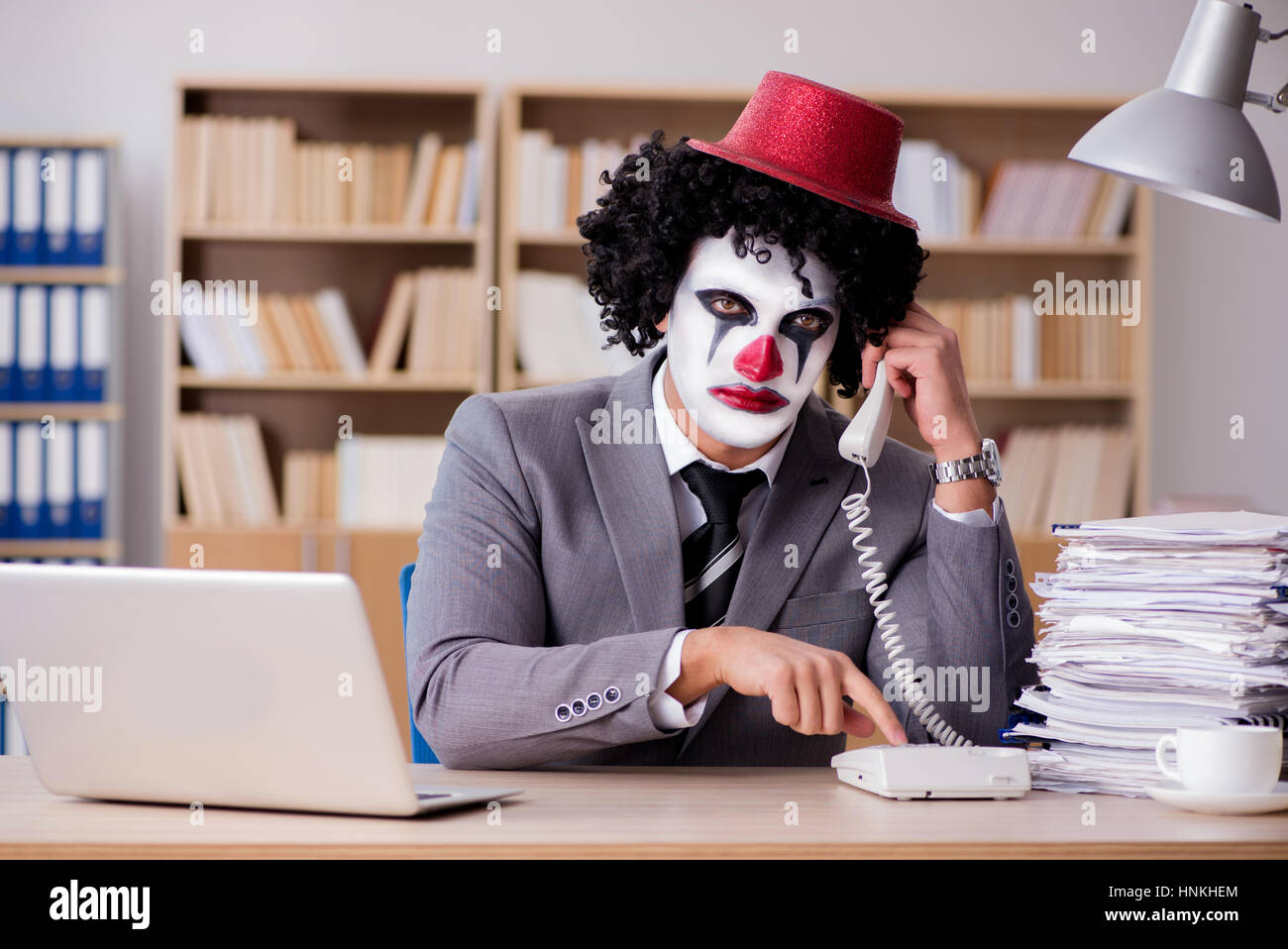 Clown businessman working in the office Stock Photo - Alamy