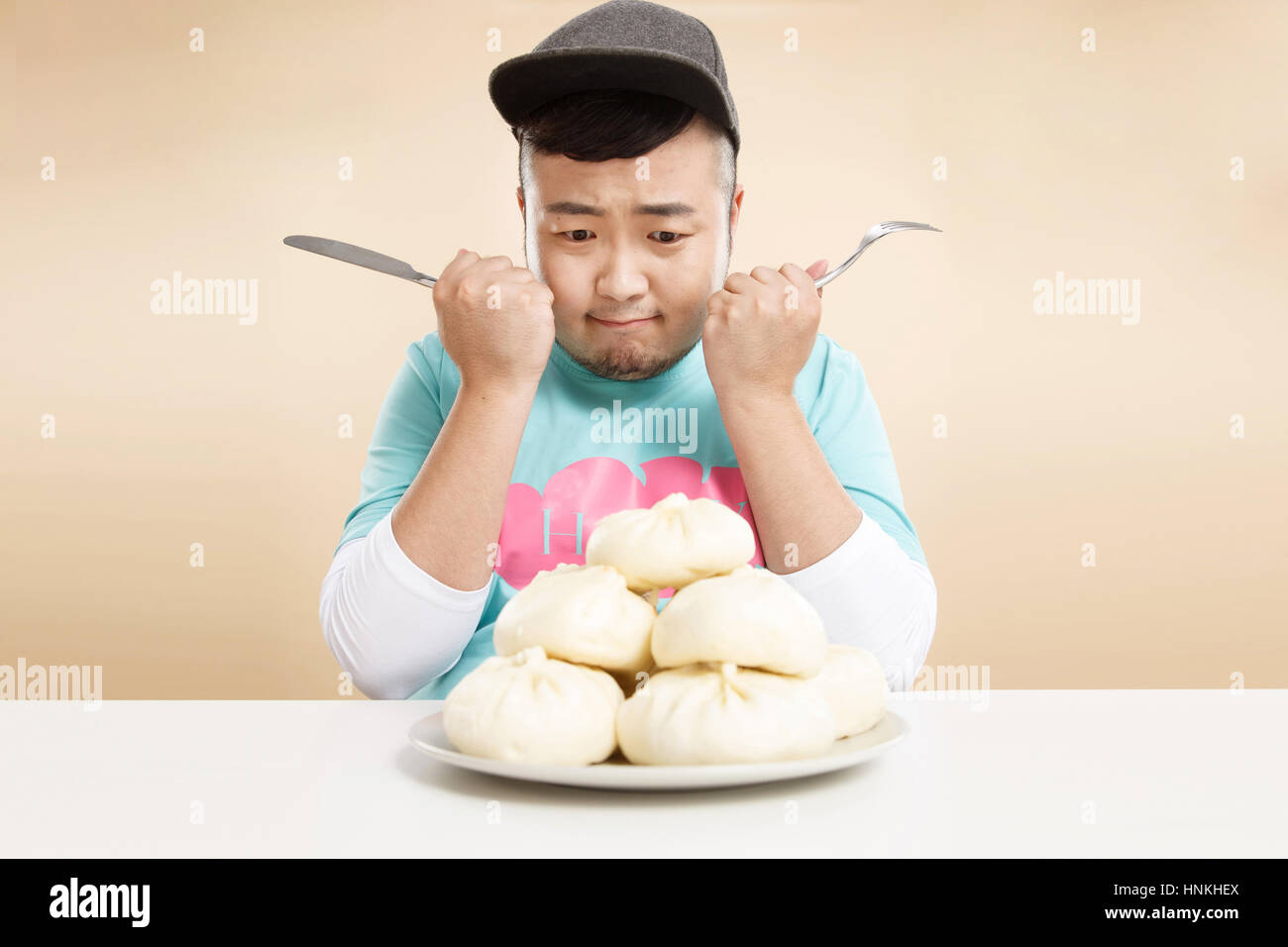 Little fat man eating hi-res stock photography and images - Alamy