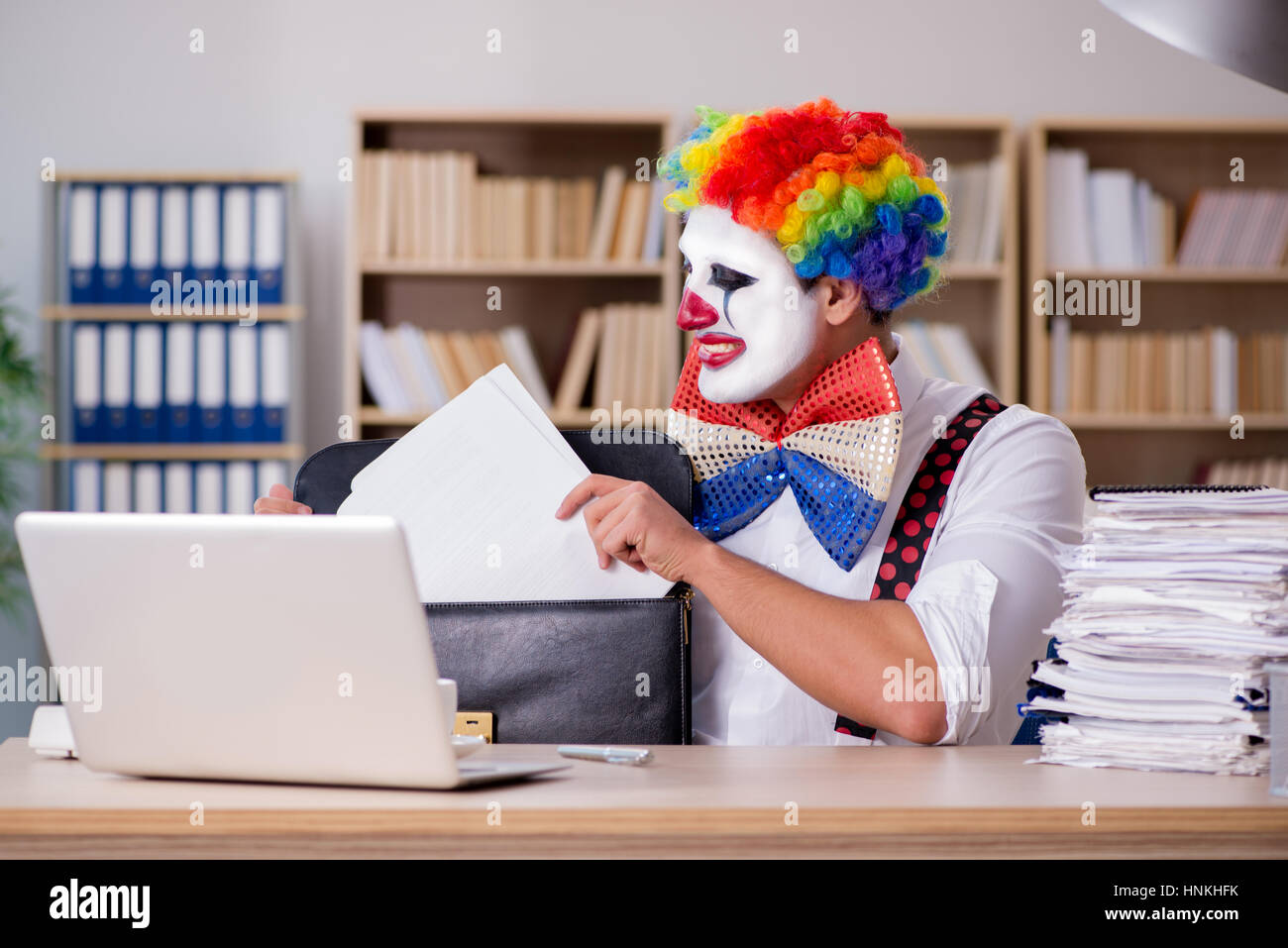 Clown businessman working in the office Stock Photo - Alamy