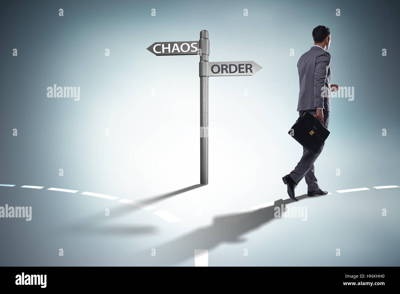 Businessman in difficult choice concept Stock Photo - Alamy