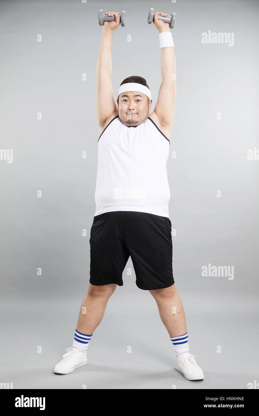 Obese young men in fitness Stock Photo - Alamy
