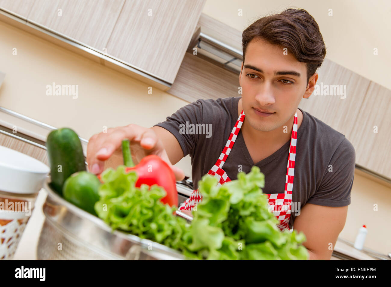 Man male cook preparing food in kitchen Stock Photo - Alamy