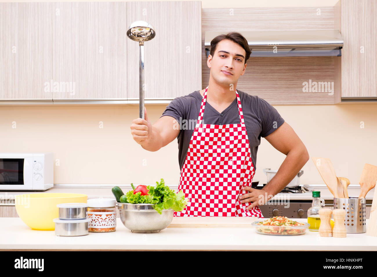Man male cook preparing food in kitchen Stock Photo - Alamy