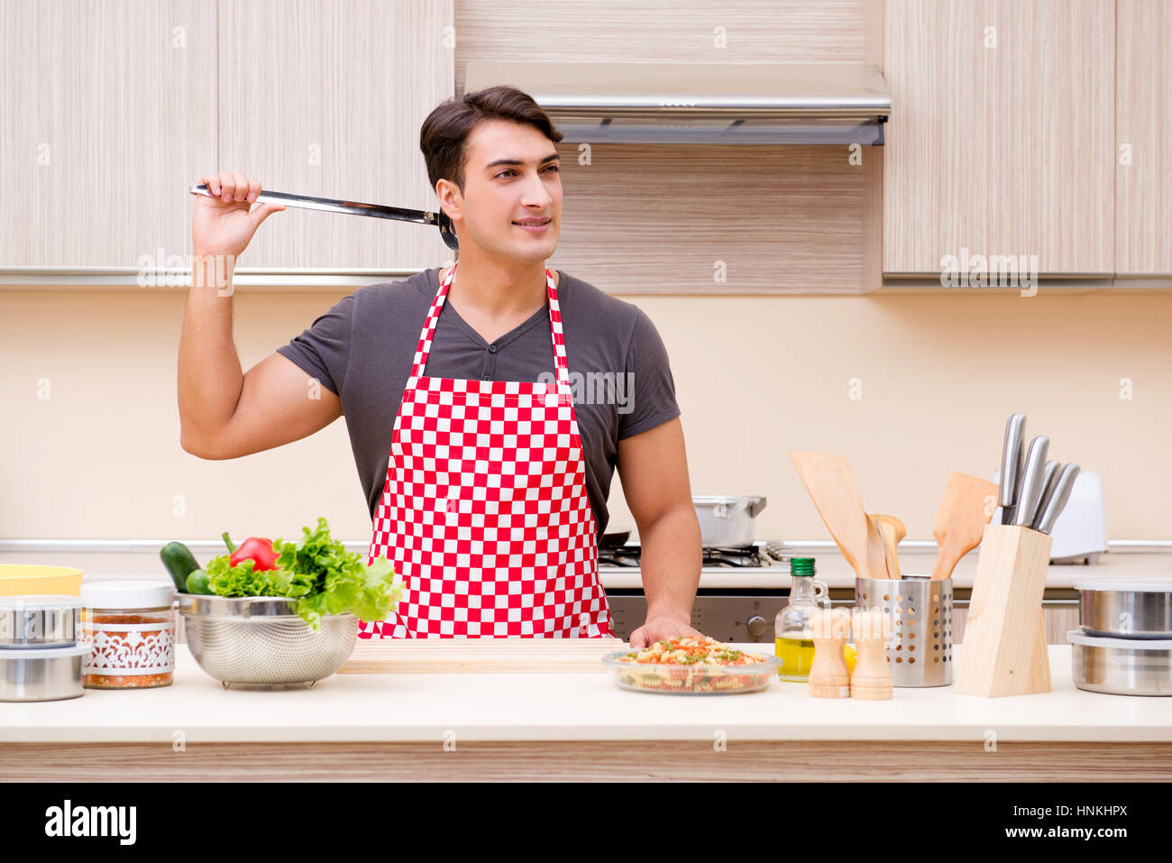 Man male cook preparing food in kitchen Stock Photo - Alamy