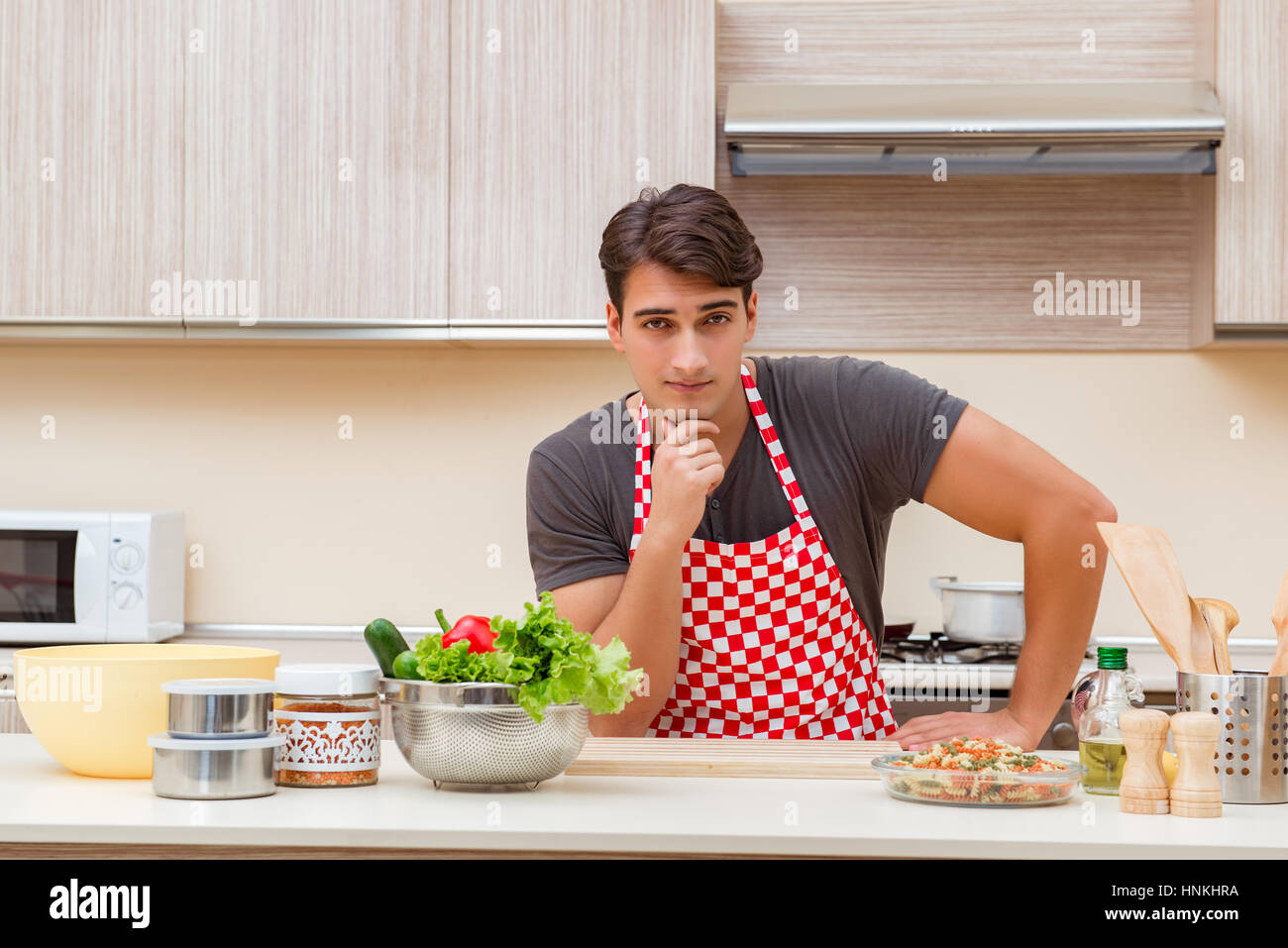 Man male cook preparing food in kitchen Stock Photo - Alamy