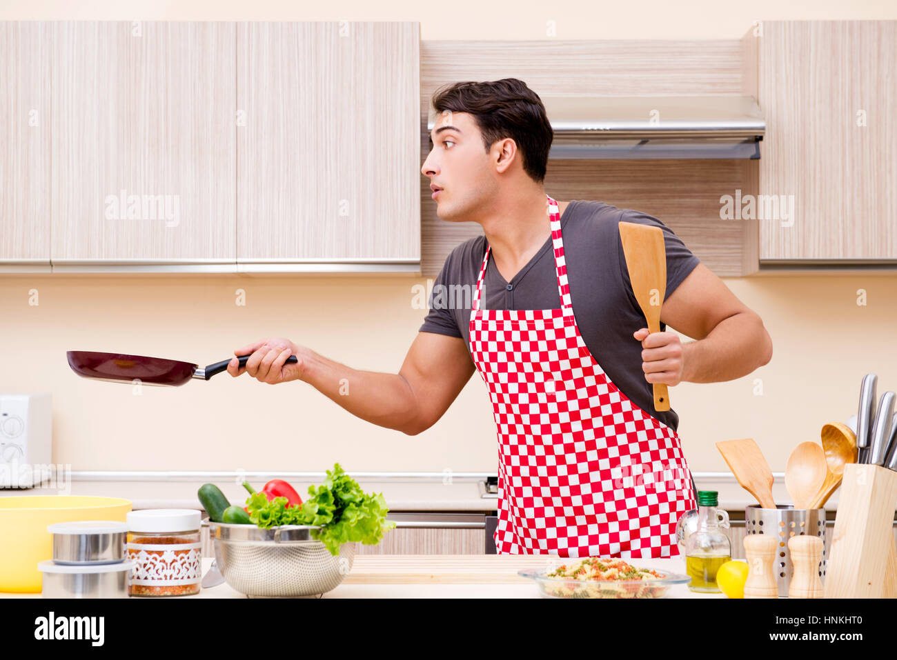 Man male cook preparing food in kitchen Stock Photo - Alamy