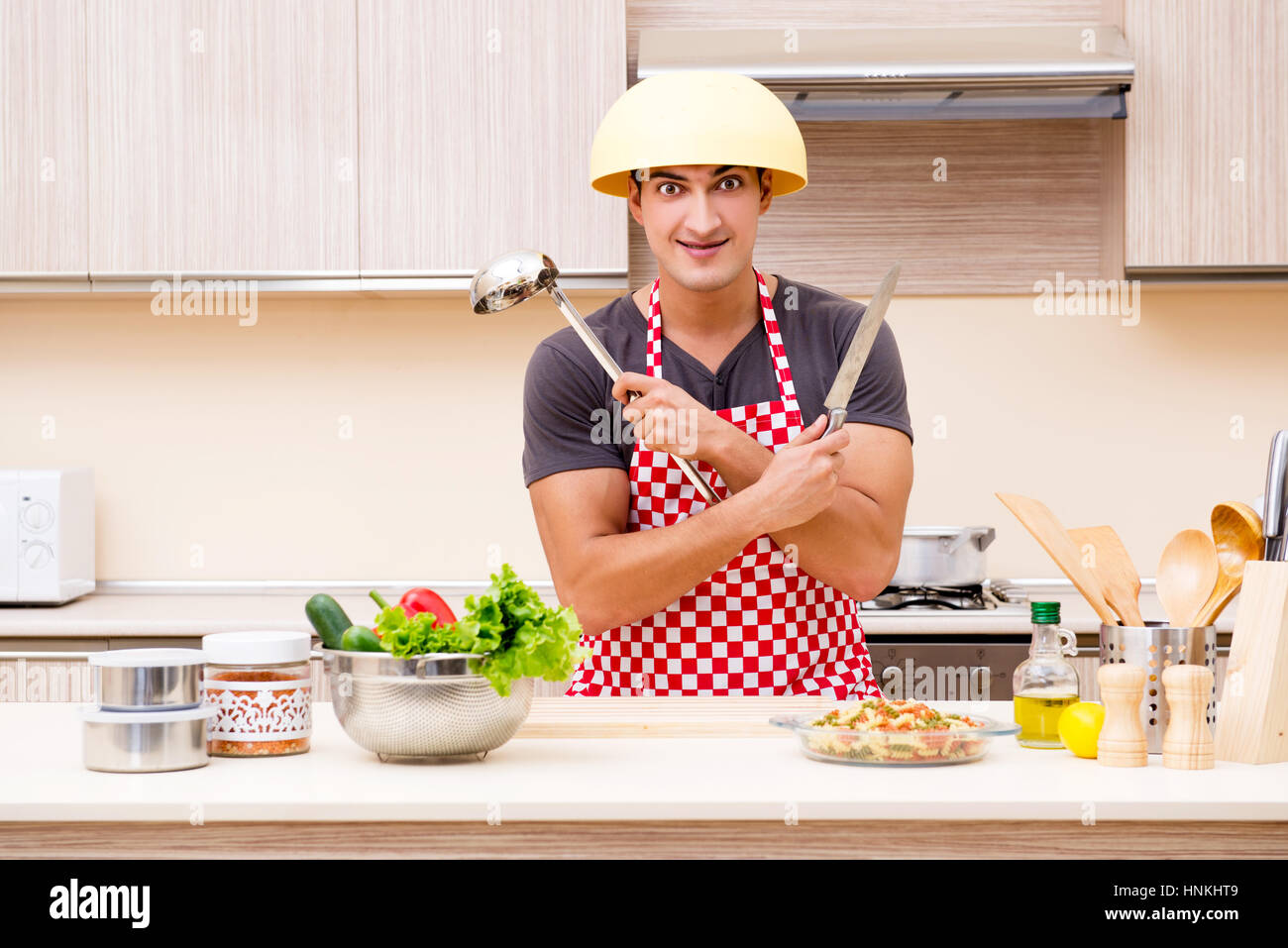 Man male cook preparing food in kitchen Stock Photo - Alamy