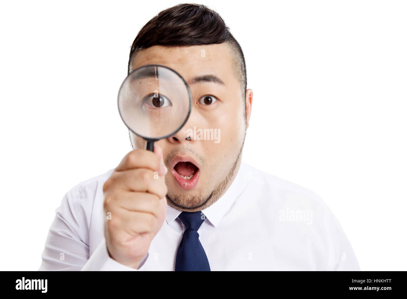 Business man with a magnifying glass Stock Photo - Alamy
