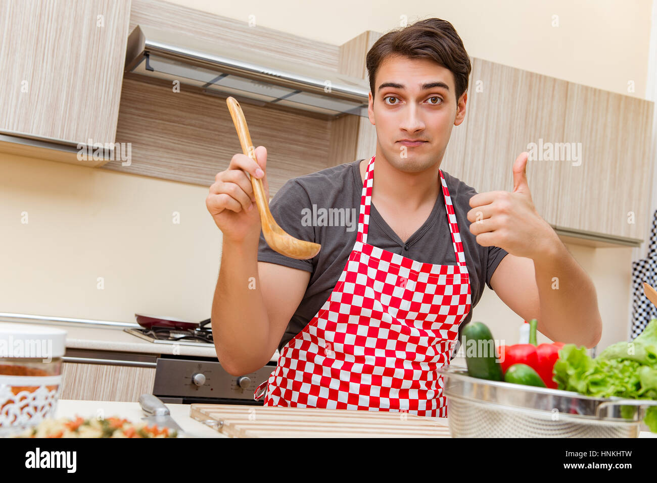 Man male cook preparing food in kitchen Stock Photo - Alamy