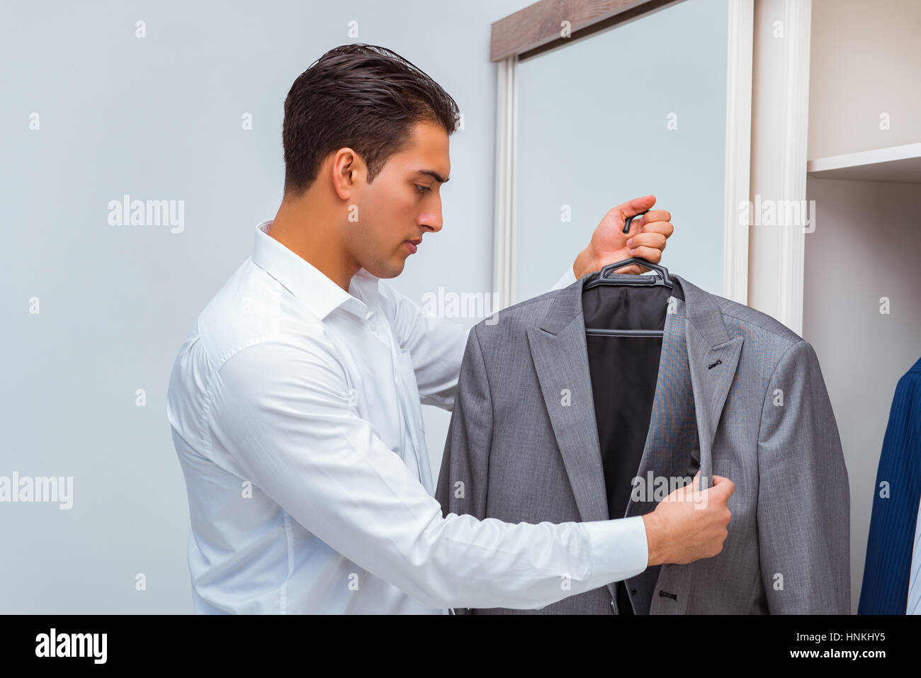 Businessman dressing up for work Stock Photo - Alamy