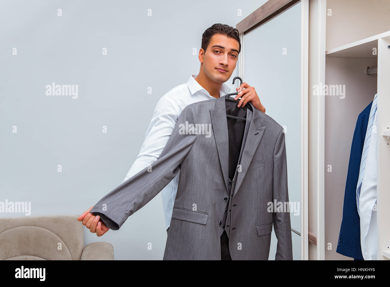 Businessman dressing up for work Stock Photo - Alamy