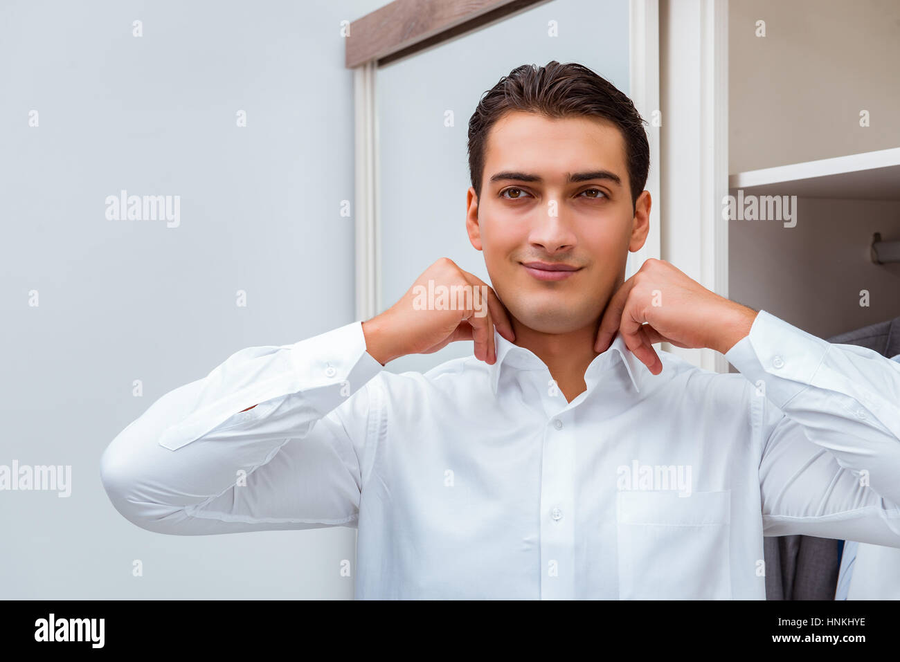 Businessman dressing up for work Stock Photo - Alamy