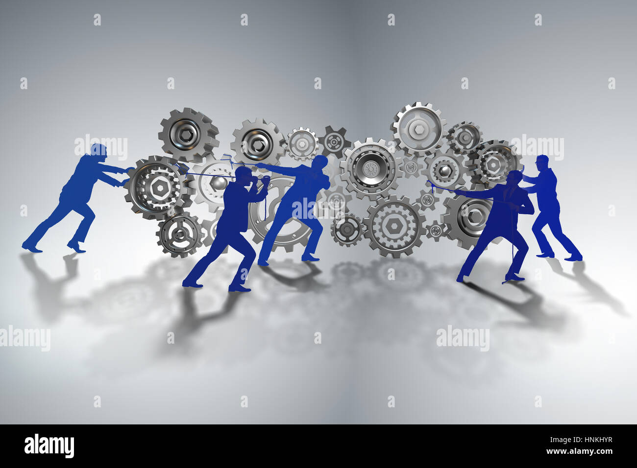 Businessman in teamwork concept with cogwheels Stock Photo - Alamy