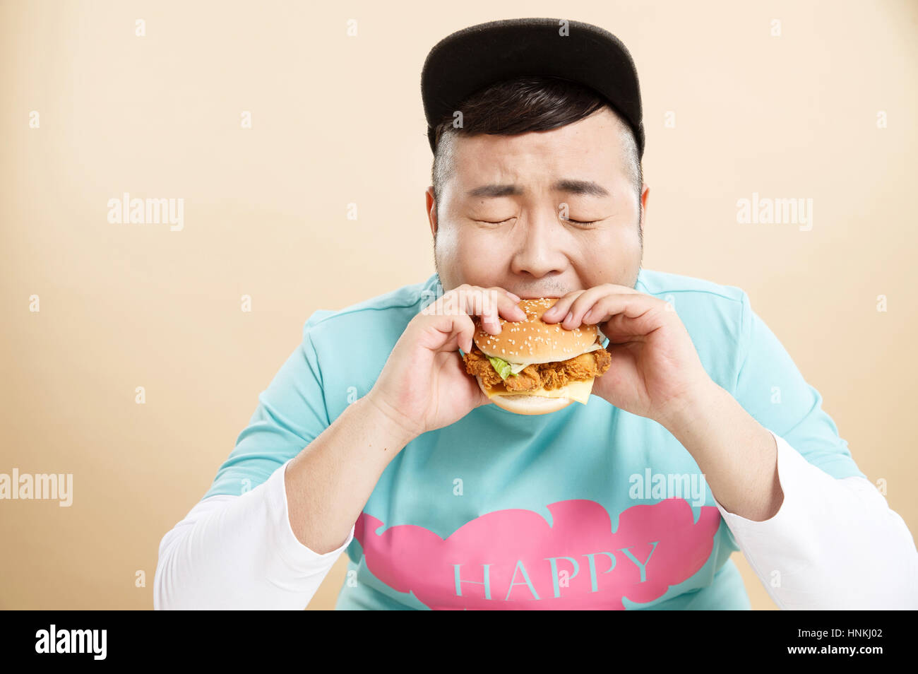 Fat man eating hi-res stock photography and images - Alamy