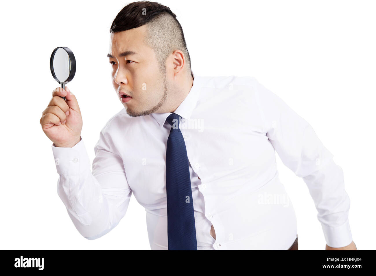Business man with a magnifying glass Stock Photo - Alamy