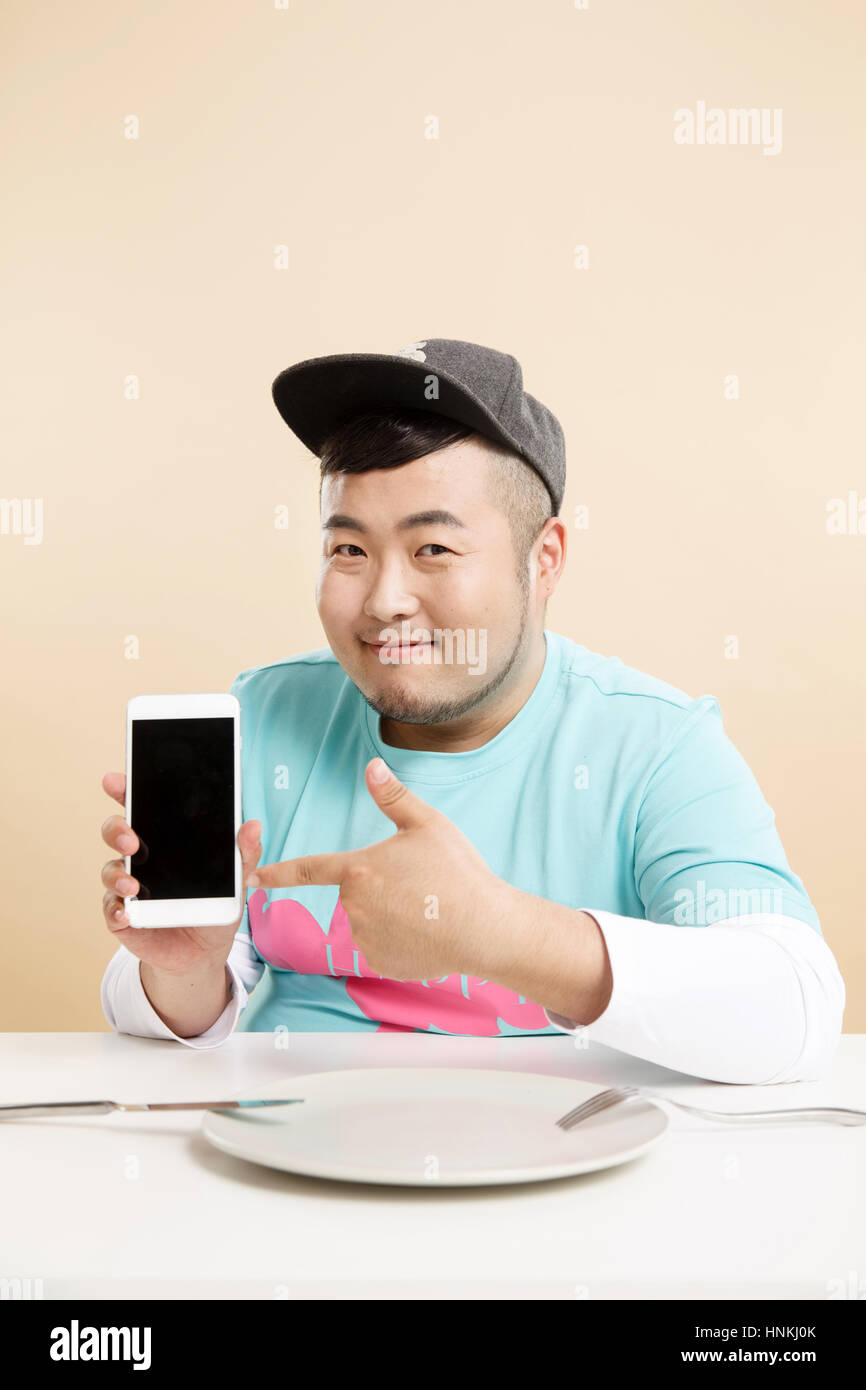 Asian man overweight phone hi-res stock photography and images - Alamy