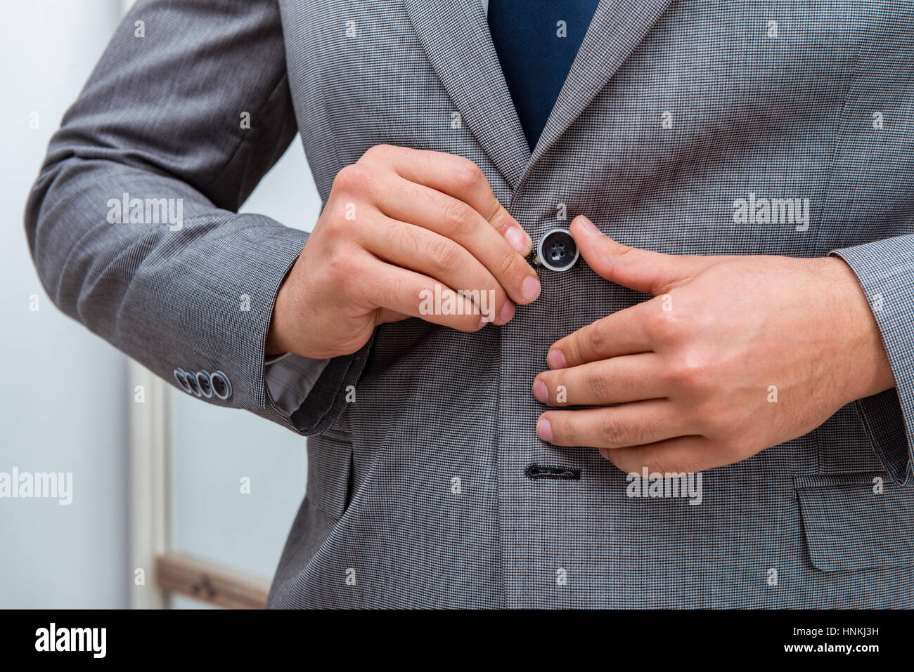 Businessman dressing up for work Stock Photo - Alamy