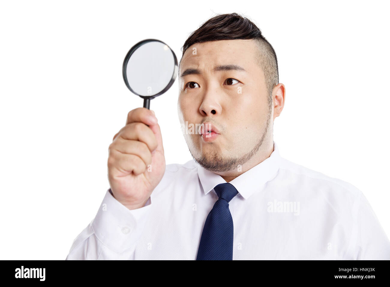 Business man with a magnifying glass Stock Photo - Alamy