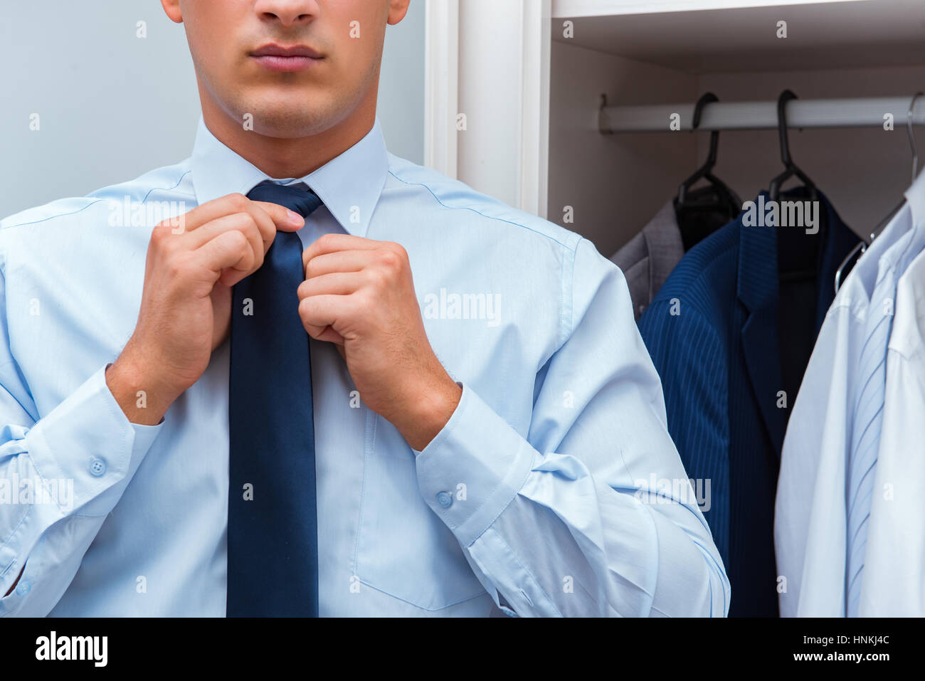 Businessman dressing up for work Stock Photo - Alamy