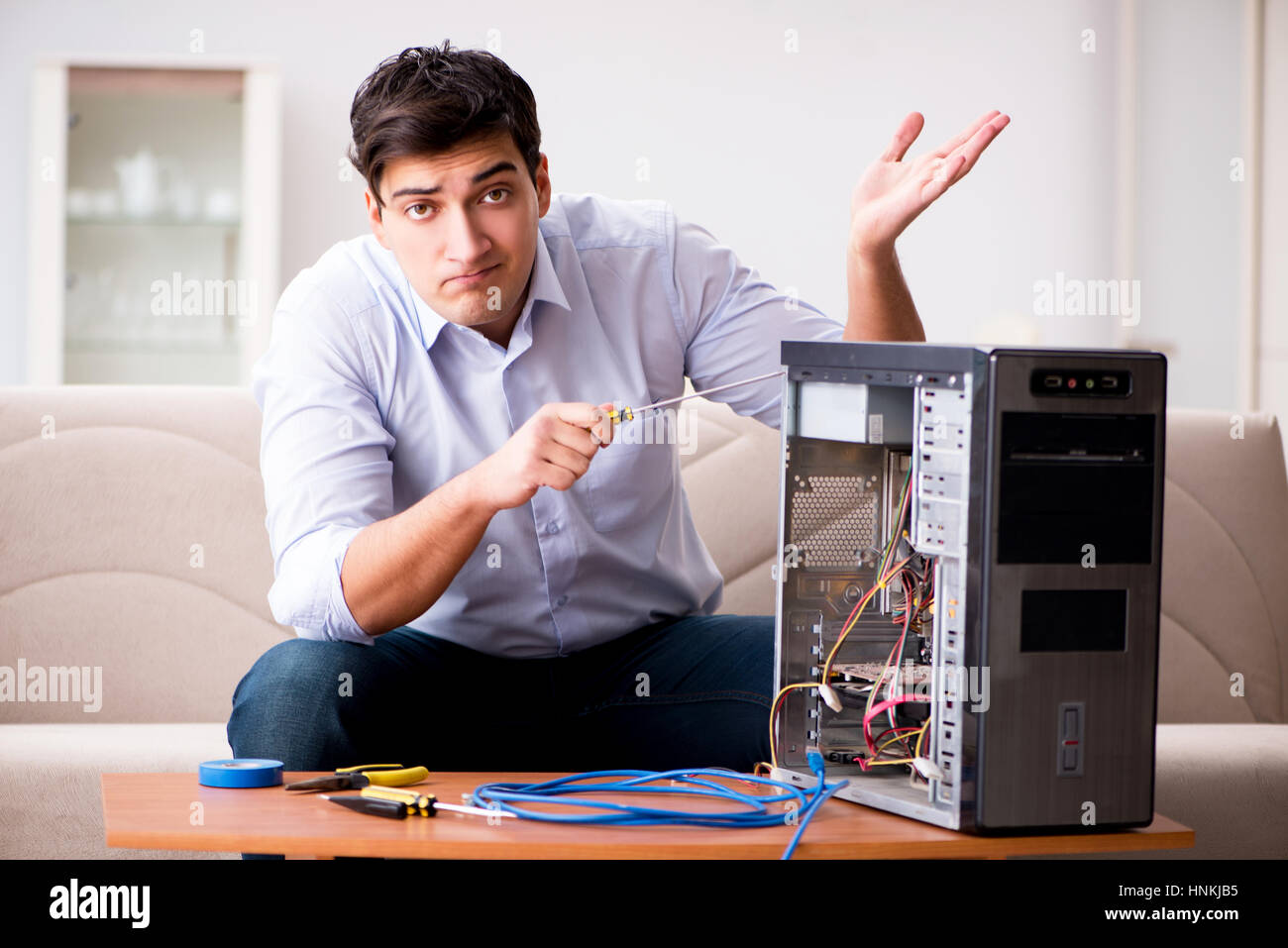 Frustrated man with broken pc computer Stock Photo - Alamy