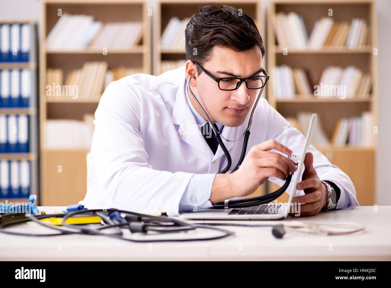 IT technician repairing broken laptop notebook computer Stock Photo - Alamy