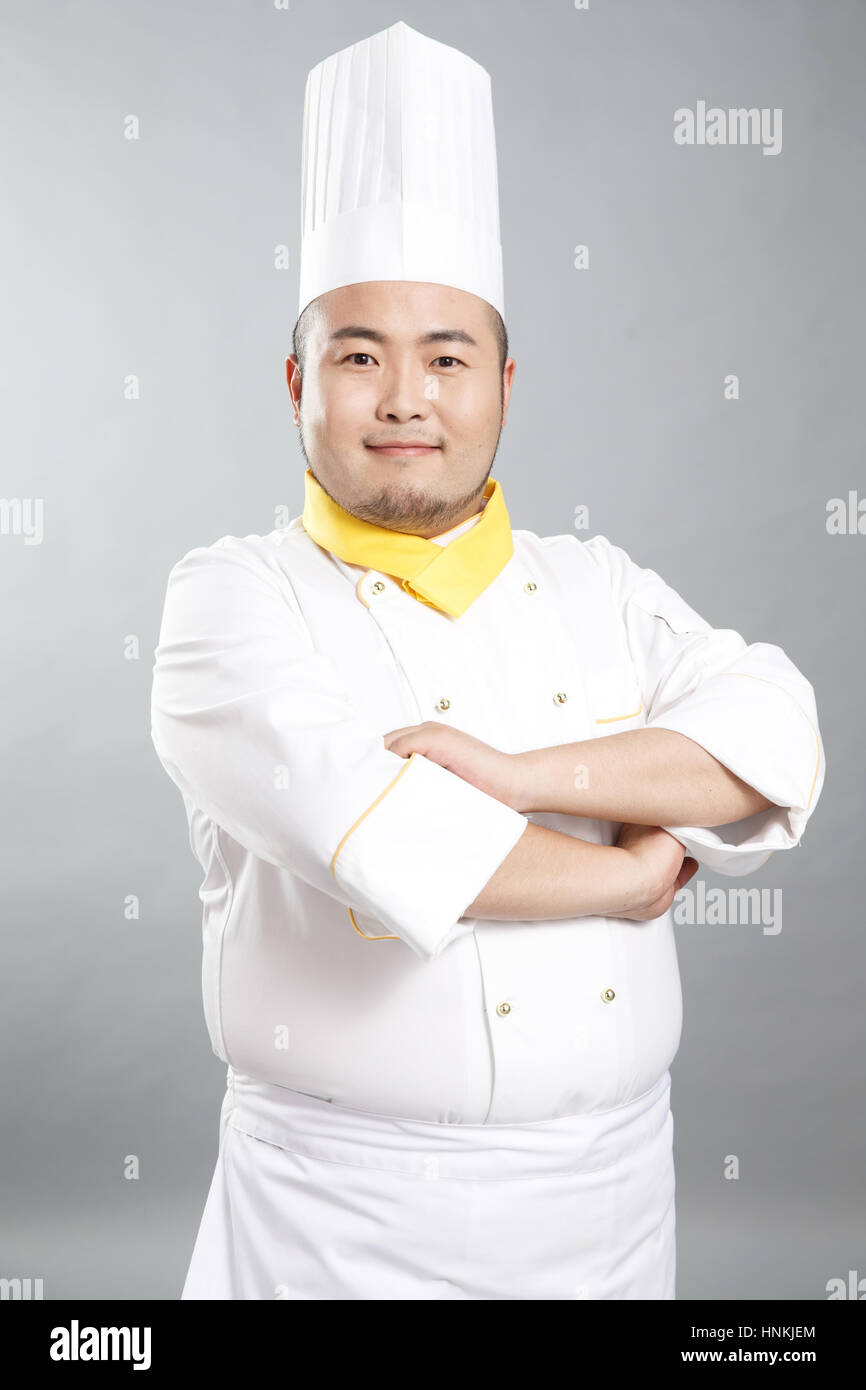 Confident young fat cook Stock Photo - Alamy
