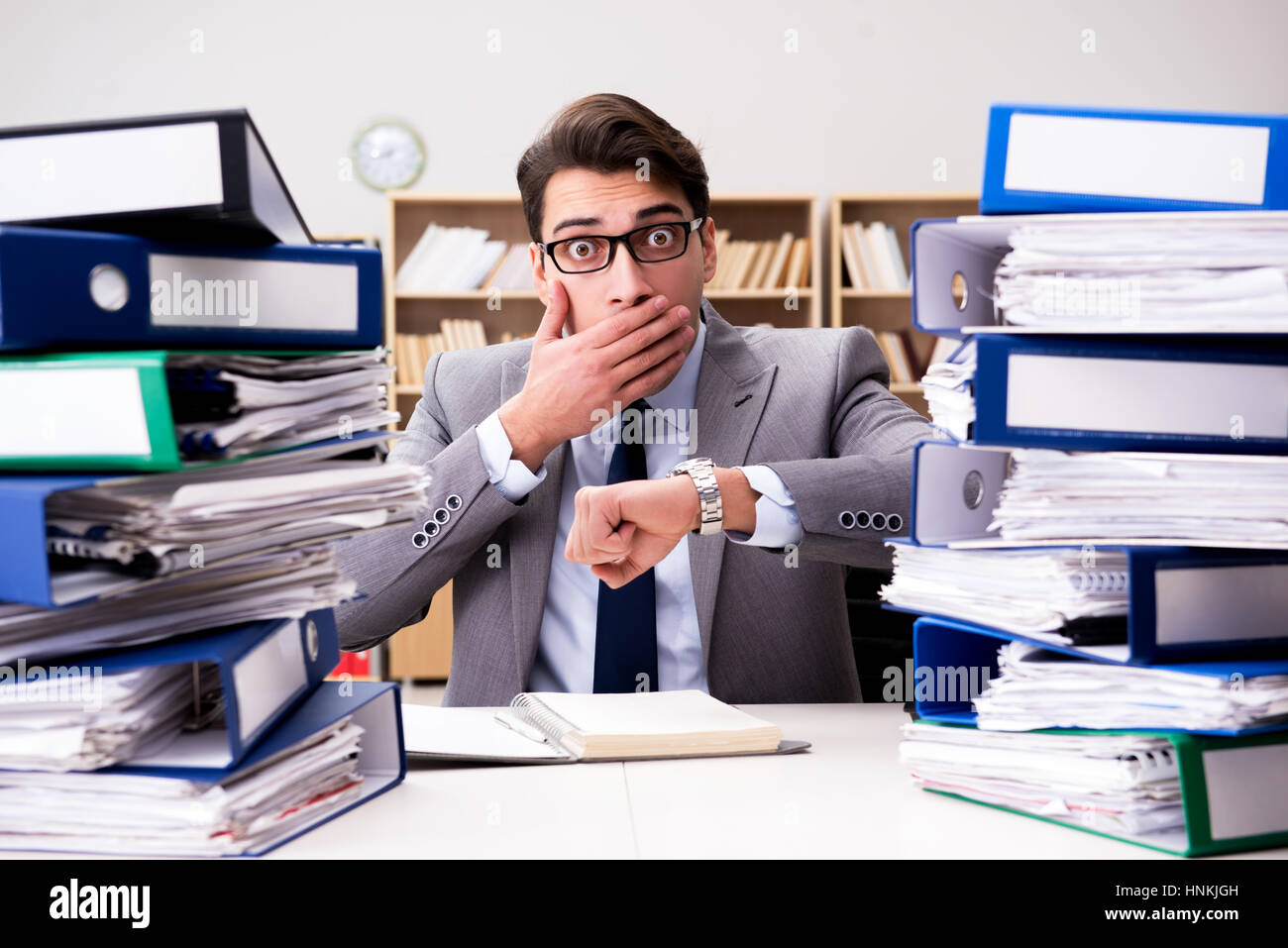 Busy businessman under stress due to excessive work Stock Photo - Alamy