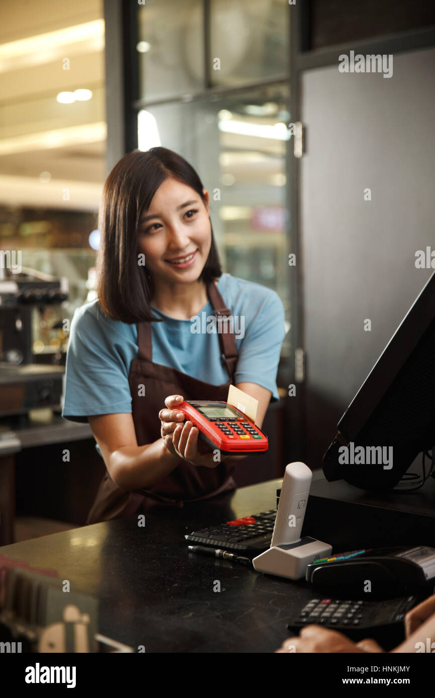 Indian cafe shopkeeper hi-res stock photography and images - Alamy