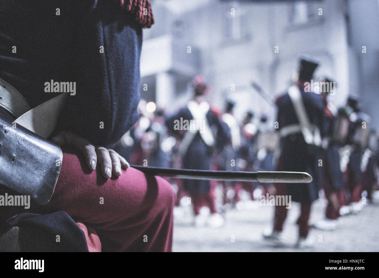 a lot of rifles/muskets leaning at a house wall with a window in Paris ...