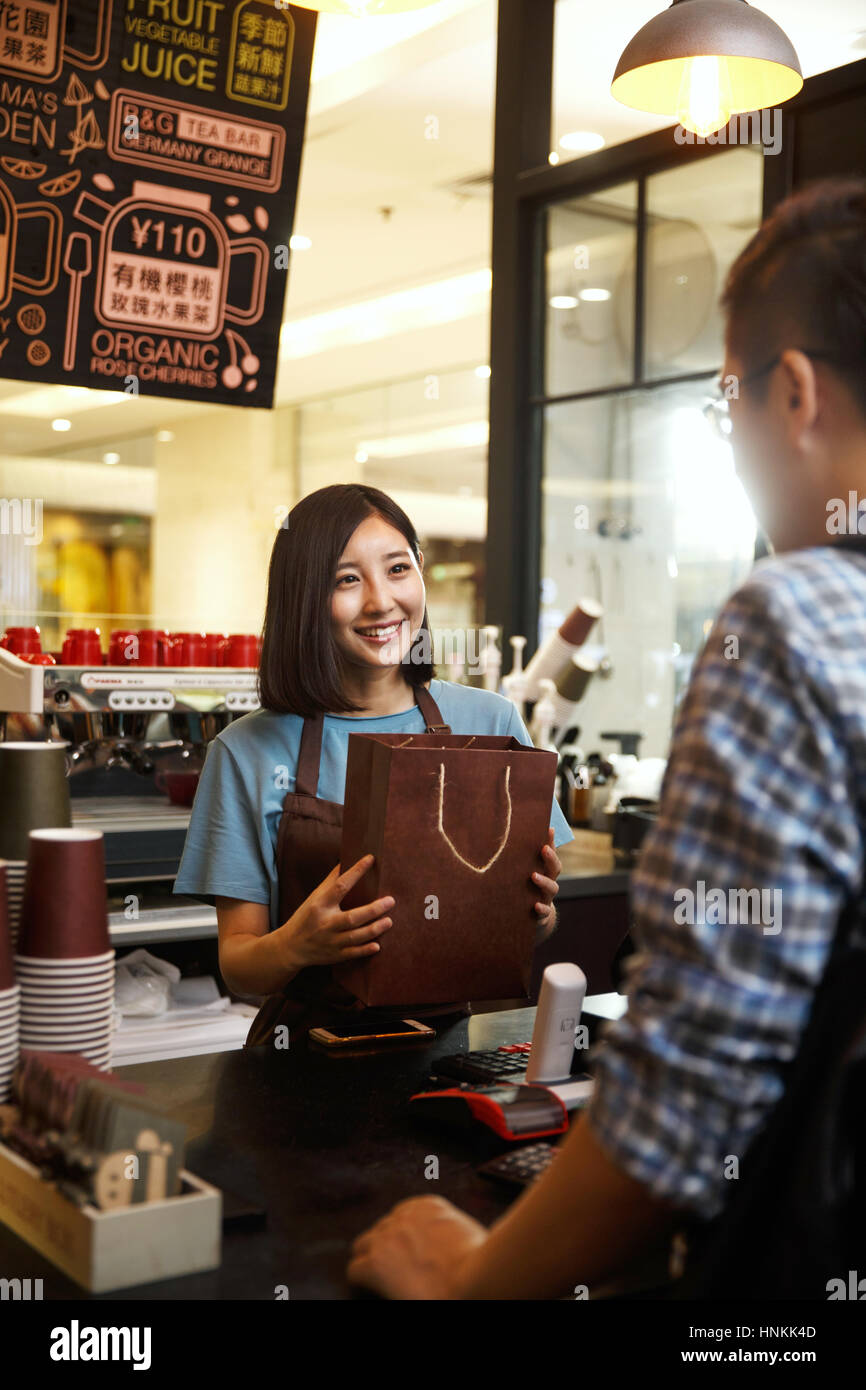 Cafe cashier and customer Stock Photo - Alamy