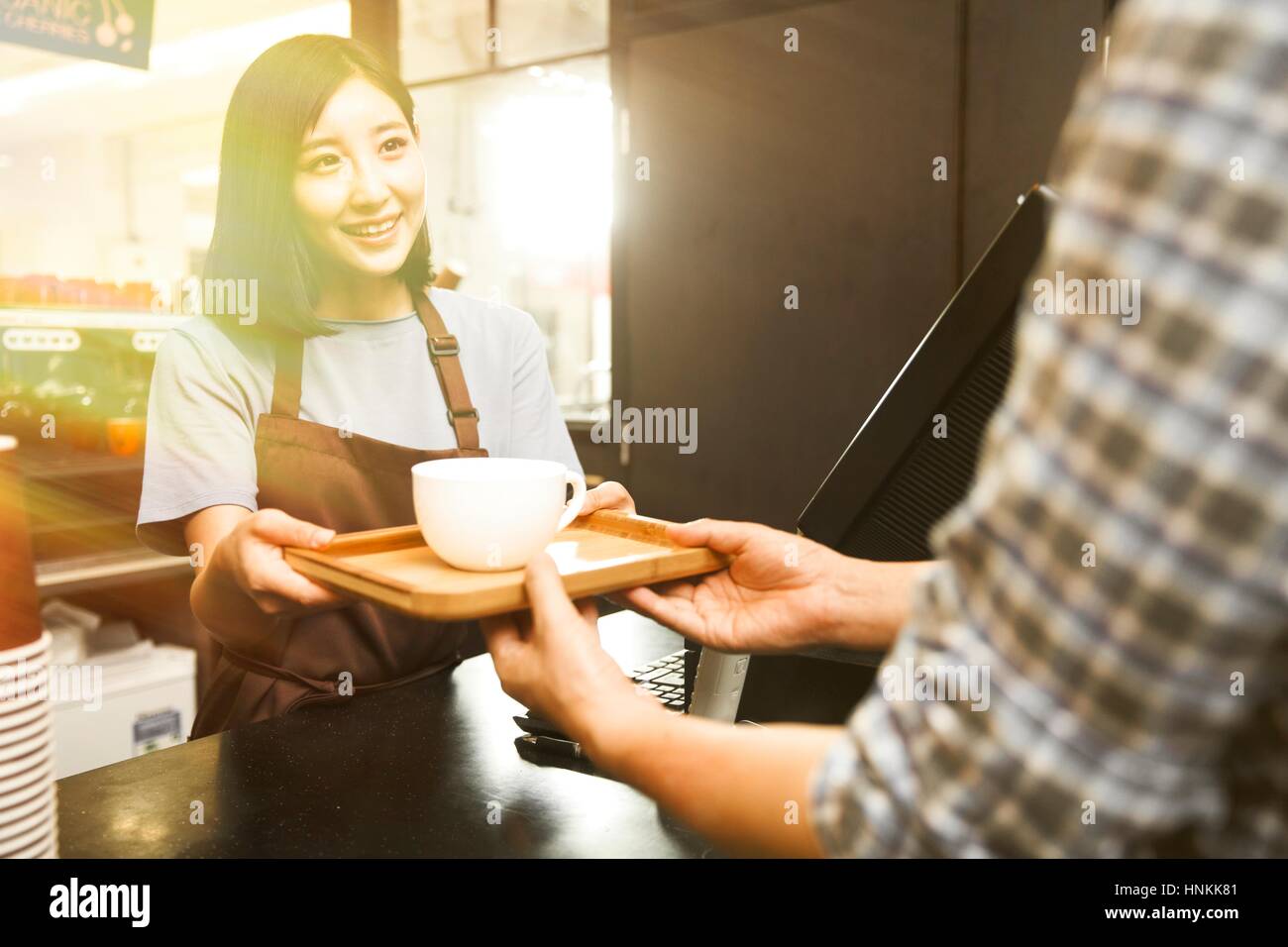 Cafe waiter and customer Stock Photo - Alamy