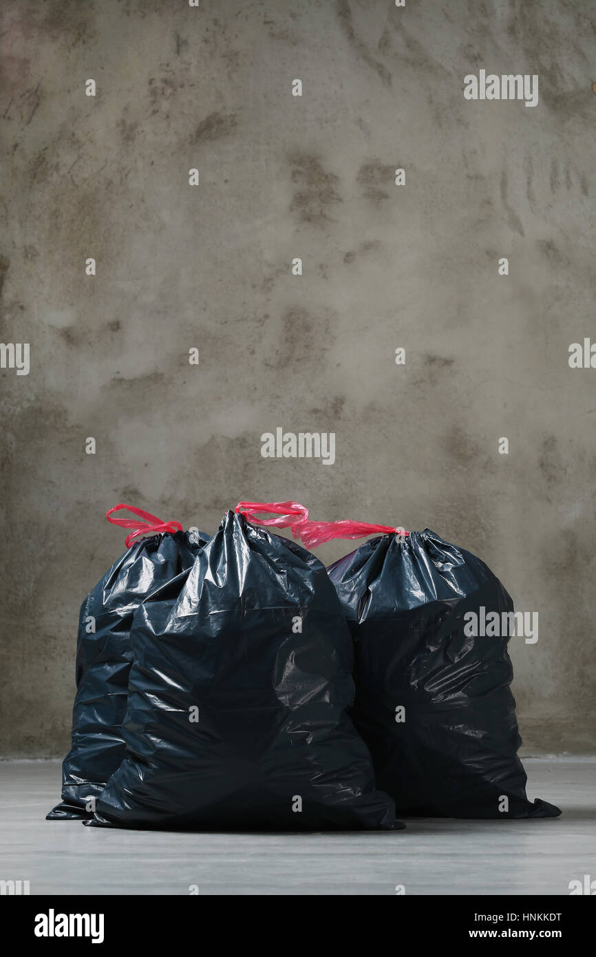 Pollution. Trash bags on the floor Stock Photo - Alamy