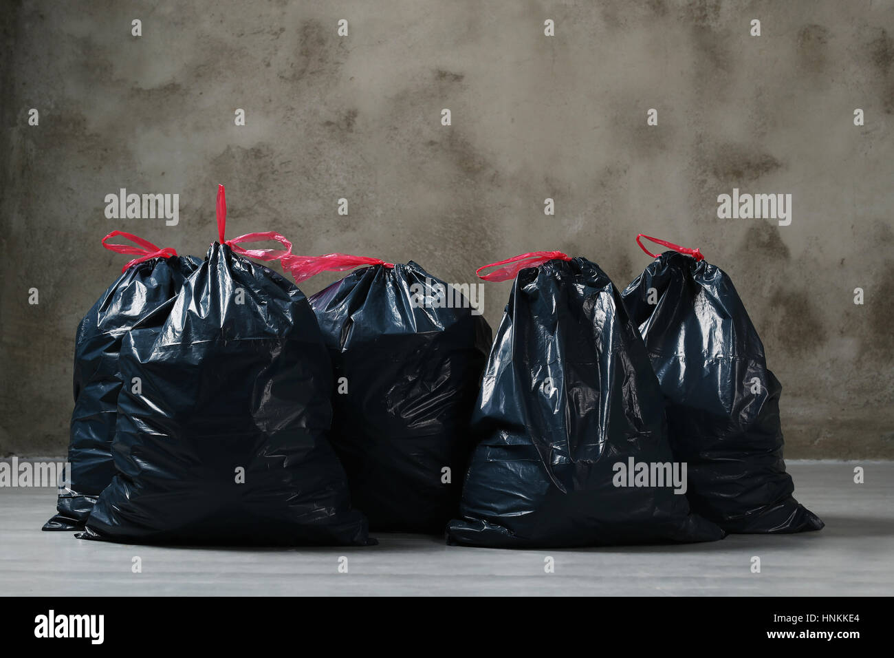 Pollution. Trash bags on the floor Stock Photo - Alamy