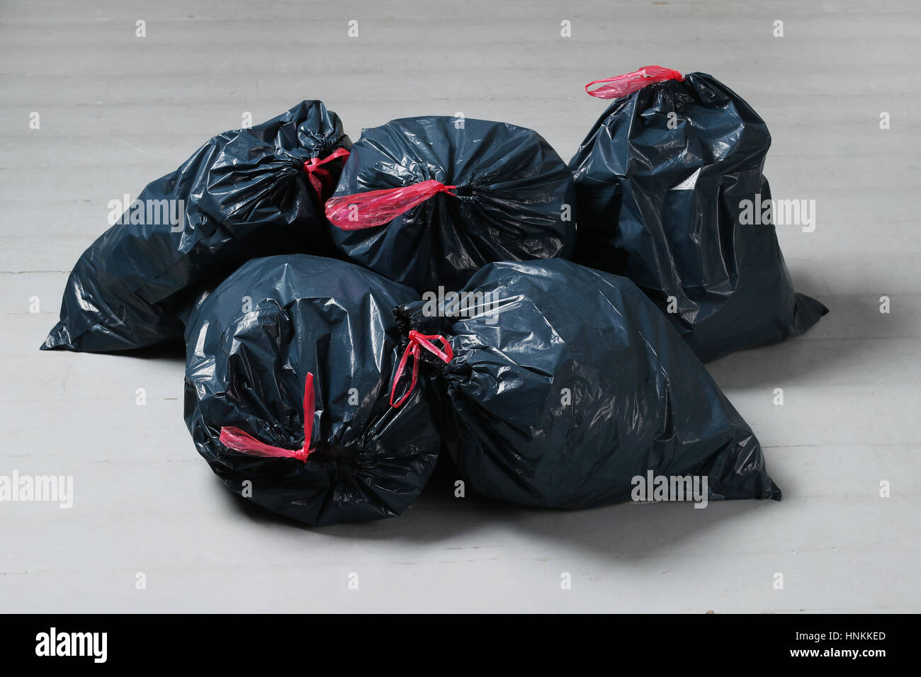 Pollution. Trash bags on the floor Stock Photo - Alamy