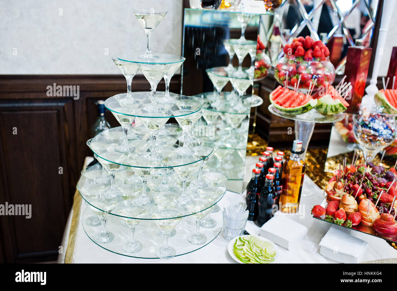 Martini glass pyramid at wedding reception Stock Photo - Alamy