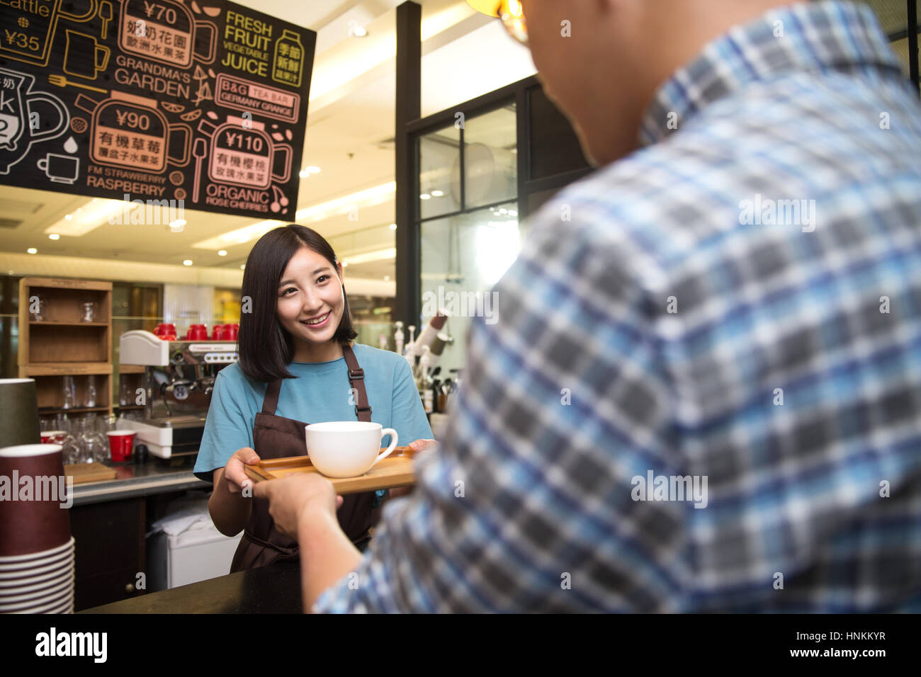 Cafe waiter and customer Stock Photo - Alamy