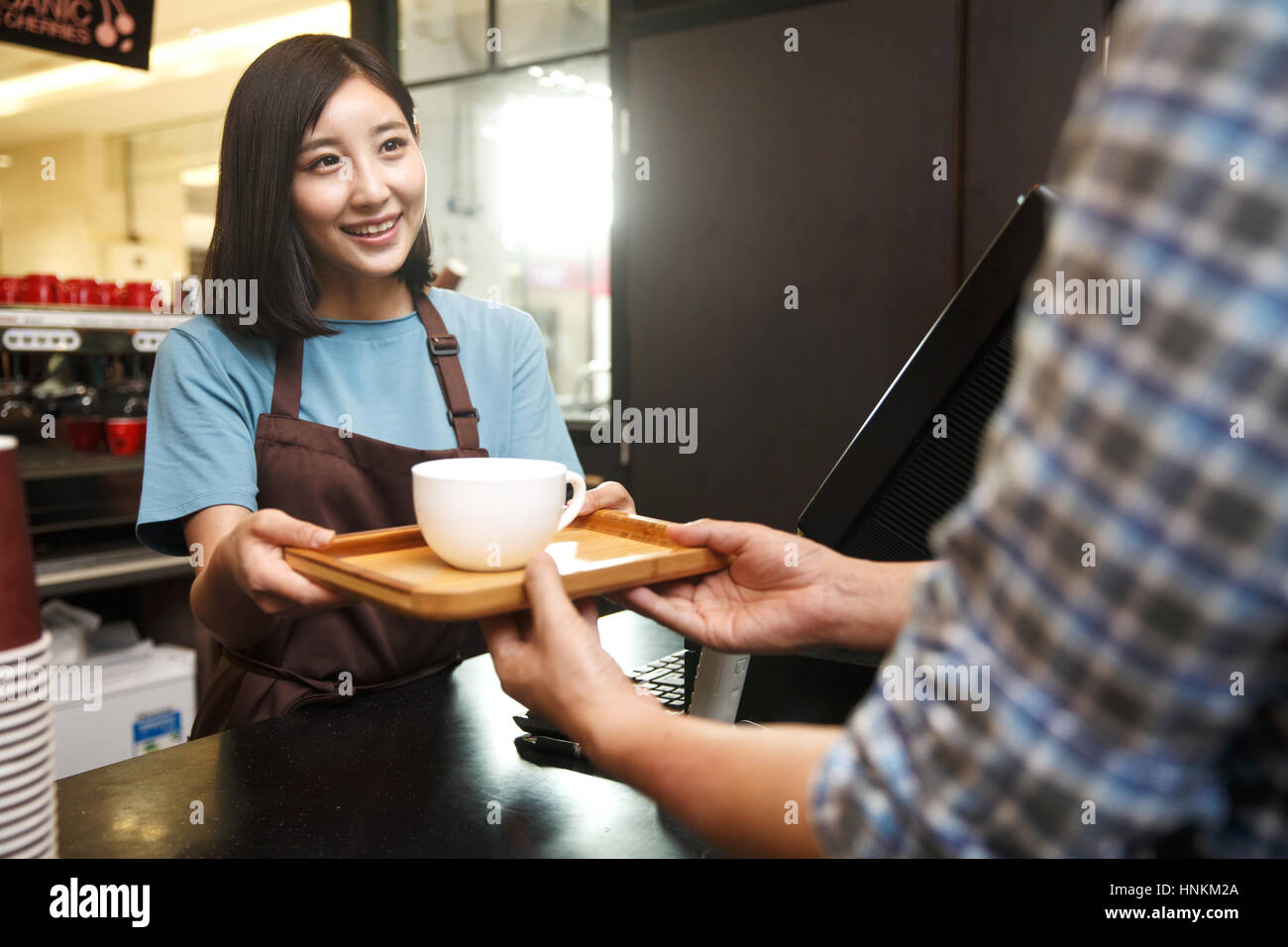 Cafe waiter and customer Stock Photo - Alamy