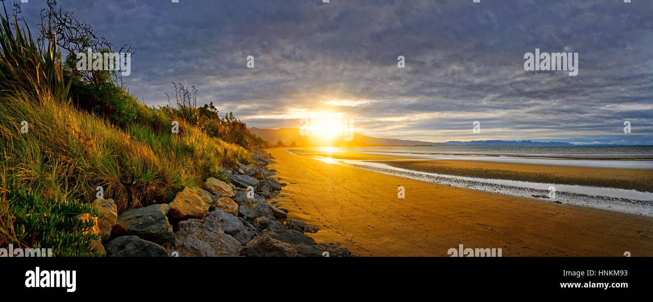 Brilliant sunset, sandy beach, Pohora Beach, Limestone Bay, Abel Tasman ...
