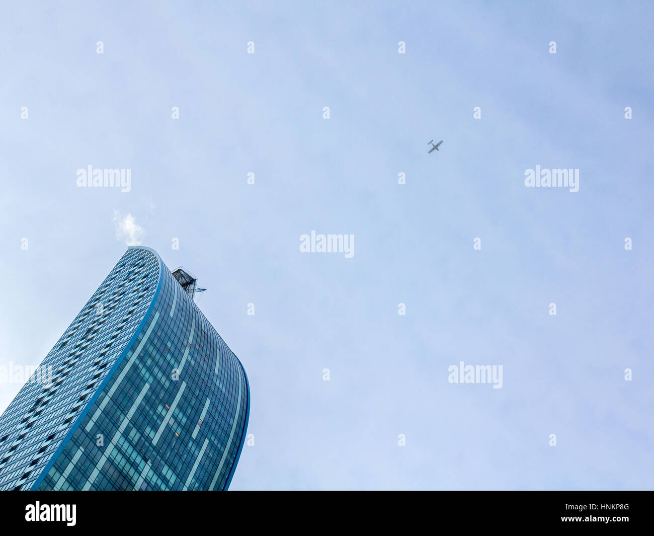 Plane flying over a skyscraper in downtown Toronto, Ontario, Canada ...