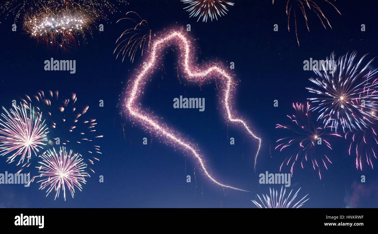 A dark night sky with a sparkling red firecracker in the shape of ...