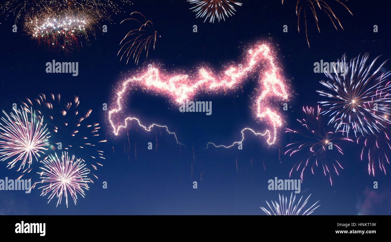 A dark night sky with a sparkling red firecracker in the shape of ...