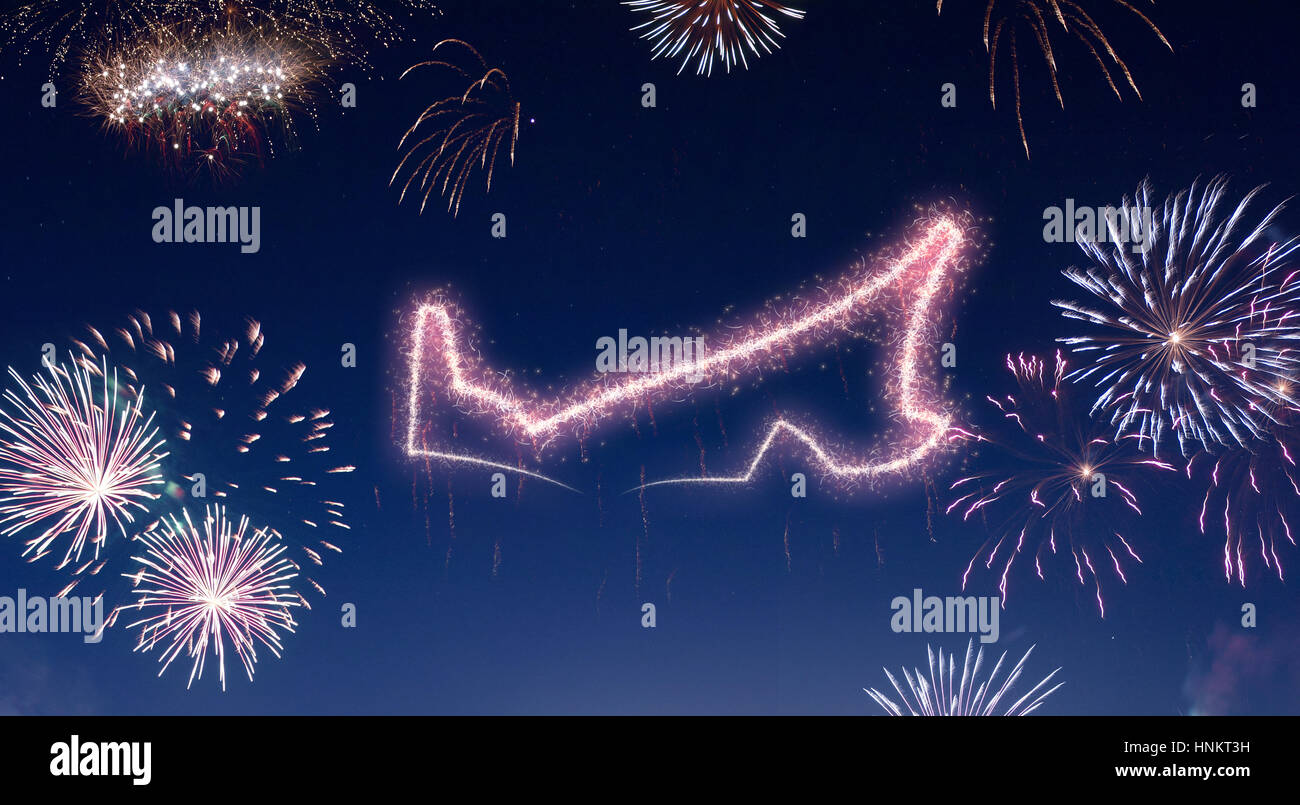 A dark night sky with a sparkling red firecracker in the shape of ...