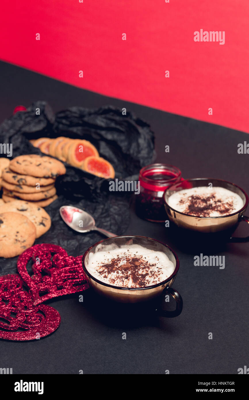 cookies and biscuits on black table background. Afternoon break time ...